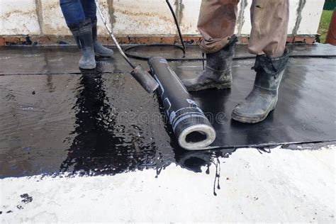 Worker Covered Surface Bitumen Primer For Improving Adhesion During
