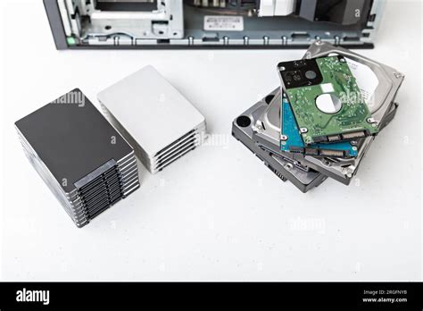 Closed Up View Of Hard Disk Drives With A Pc In The Background Upgrade