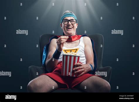 Funny Happy Superhero Watching Comedy Movies And Eating Popcorn He Is