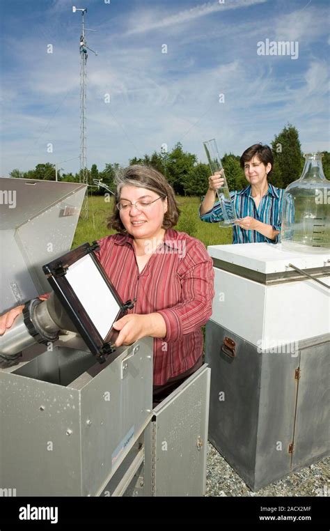 Atmospheric Pollutant Research Chemists Using Air Left And Rain Right Sample Collection