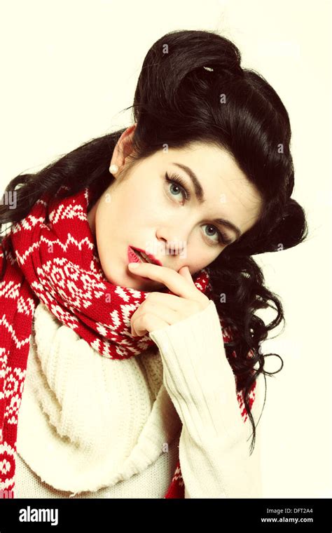 Portrait Of Young Retro Brunette Girl In Warm White Sweater And Red