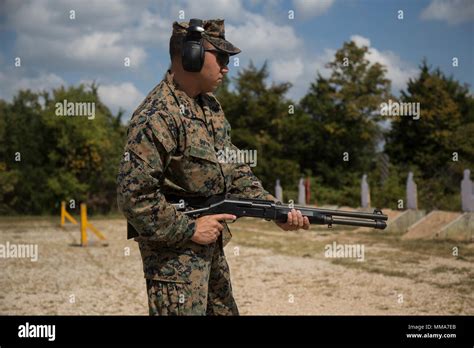 A Us Marine Assigned To The Military Police Basic Course Fires The