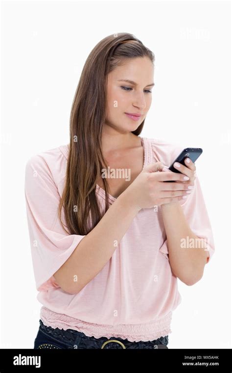 Close Up Of A Girl Typing A Text Message Against White Background Stock Photo Alamy
