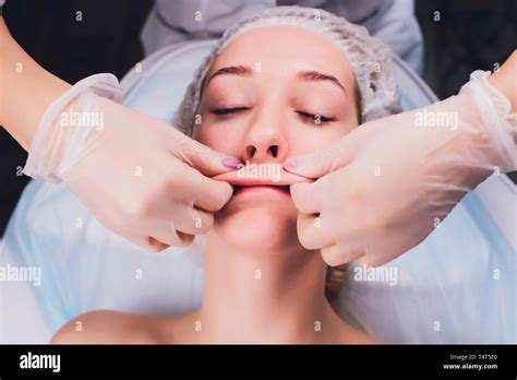 Cosmetologist Makes A Buccal Massage Of The Patients Facial Muscles