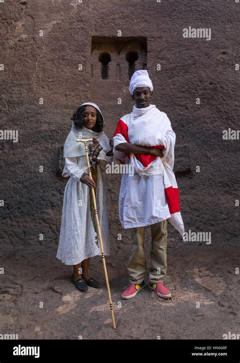 Orthodox Ethiopian Priest With His Wife In A Rock Church Amhara Region Lalibela Ethiopia