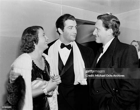 Actor Robert Taylor And His Wife Actress Barbara Stanwyck Talk With
