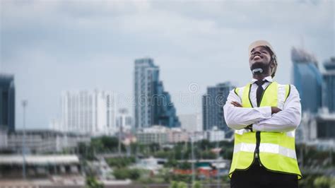 African Architect Engineer Man With White Safety Helmet Standing At