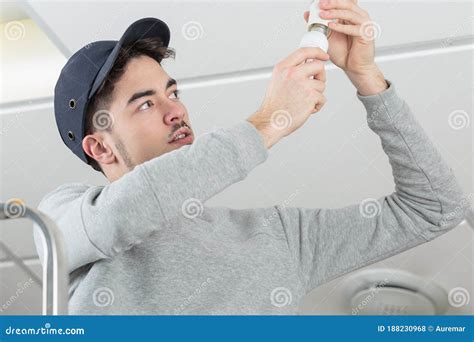 Man Changing Light Bulb Stock Photo Image Of Ceiling