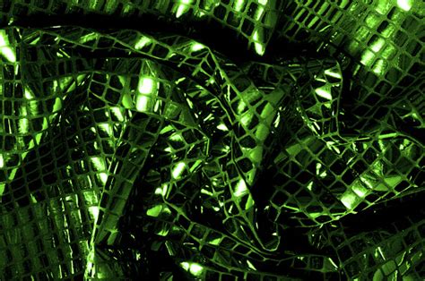 텍스처 배경 패턴입니다 녹색 큰 Paillettes 가진 직물에 의하여 이루어져 있다 큰 반짝임의 이러한 여러 가지 빛깔된의 기름 얼룩과 관심에 대 한 준비가 되어 날카로운