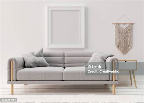 현대 거실의 흰색 벽에 빈 그림 프레임 스칸디나비아 보헤미안 스타일로 인테리어를 모의 여유 공간 사진의 공간을 복사합니다 회색 소파 3d 렌더링 소파에 대한 스톡 사진 및