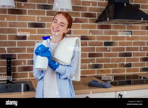 Caucasian Redhaired Ginger Housewife In Casual Clothes And Gloves