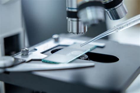 Close Up Of A Microscope With A Test Glass Under The Lens Stock Image Image Of Chemistry