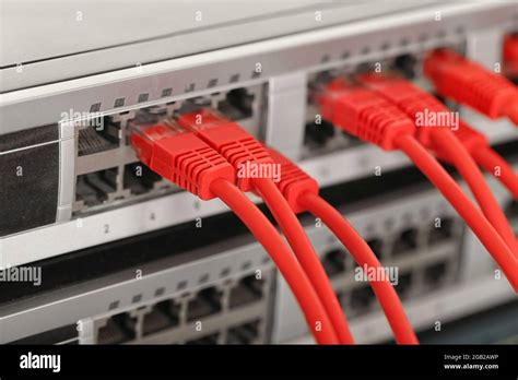 Red Ethernet Cables Connected To Network Switch Close Up Stock Photo Alamy