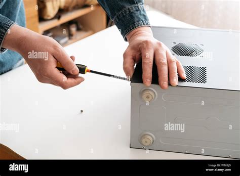 Technician Disassemble Computer With A Screwdriver For Problems Diagnostic And Repair Stock