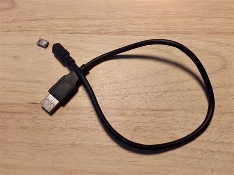 Premium Photo High Angle View Of Usb Cable On Wooden Table
