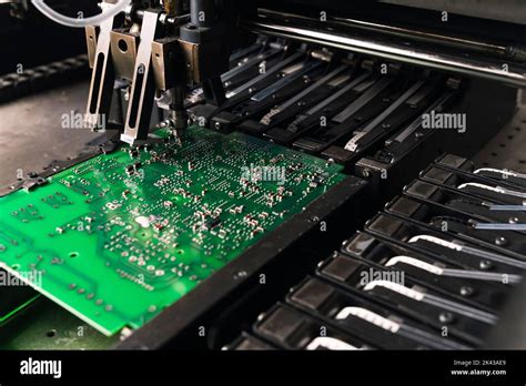 Close Up Shot Of Smd Surface Mount Device Working On Printed Circuit Board Pcb Assembling