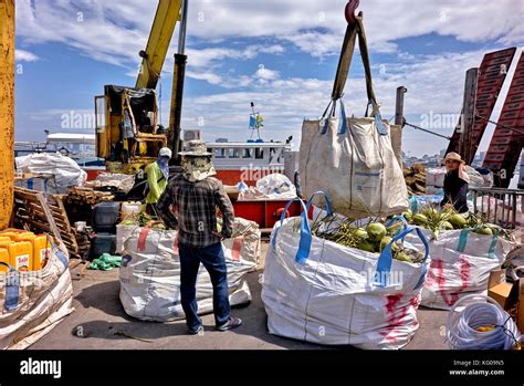 Crane Loading And Unloading Boat Dockworkers At Pattaya Commercial Shipping Port Thailand