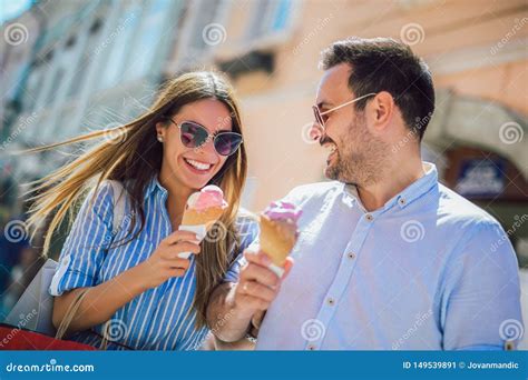 Couple Having Date And Eating Ice Cream After Shopping Stock Image