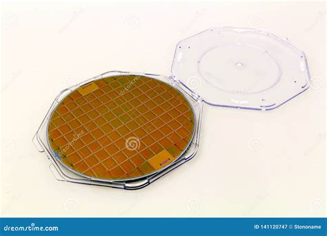 Silicon Wafers In Plastic Holder Box On A Table A Wafer Is A Thin Slice Of Semiconductor