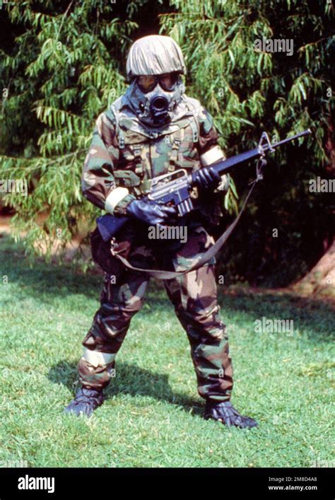 A Soldier Wearing Mission Oriented Protective Posture Response Level 4 Mopp 4 Gear Including