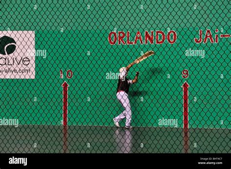 Jai Alai Player Prepares To Catch The Ball Pelota In His Woven Basket
