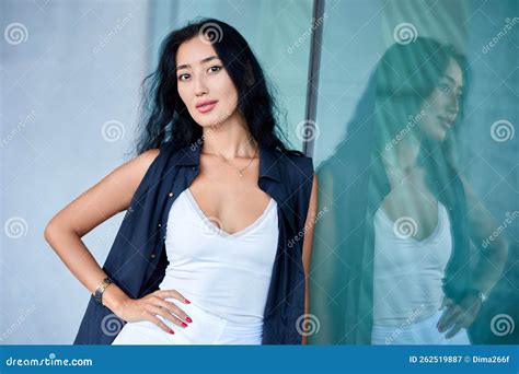 Fashion Close Up Portrait Of Young Woman Posing Near To Showcase Stock