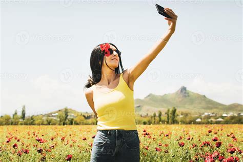 Beautiful Caucasian Woman Pose Selfie With Smartphone In Nature For