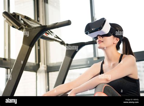 Beauty Asian Woman Rest On Treadmill With Virtual Reality Vr Headset