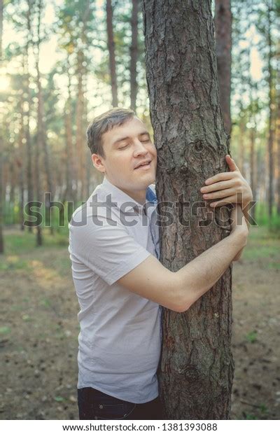 Man Hugging Tree Forest Smiling Babe Stock Photo Edit Now