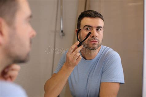 Man Using Threading As A Method For Hair Removal Stock Photo Image Of