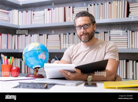 Teacher In Classroom Knowledge And Education With Handsome Teacher