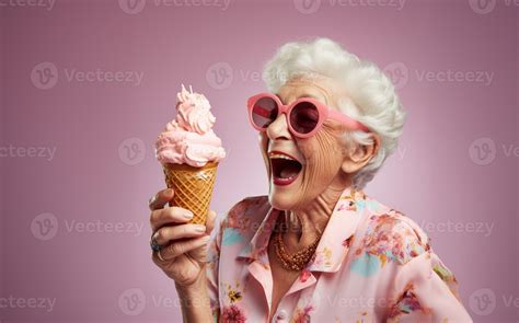 An Elegant Older Woman Adorned With Stylish Sunglasses Enjoys A Moment Of Indulgence As She