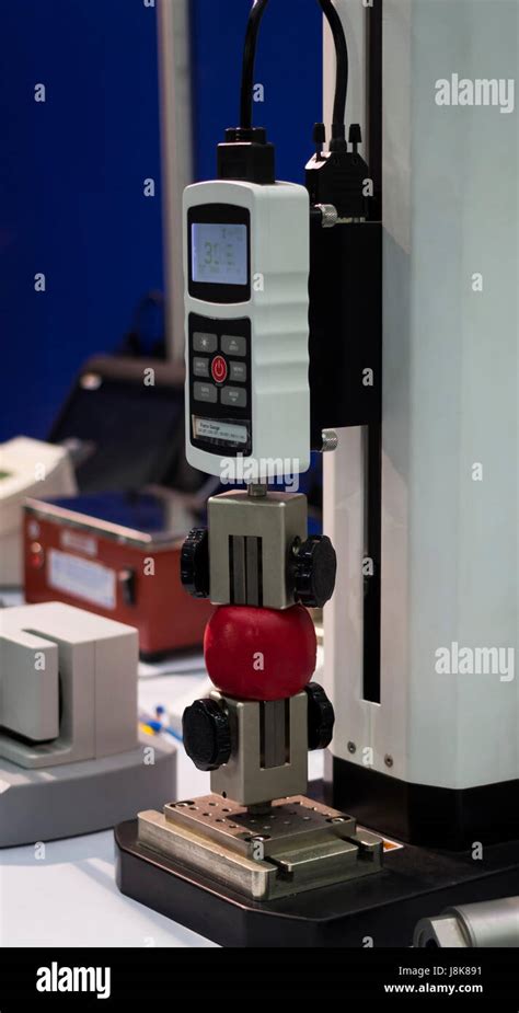 Tensile Compressive Testing Machine In Engineering Laboratory With Load Cell To Calculated