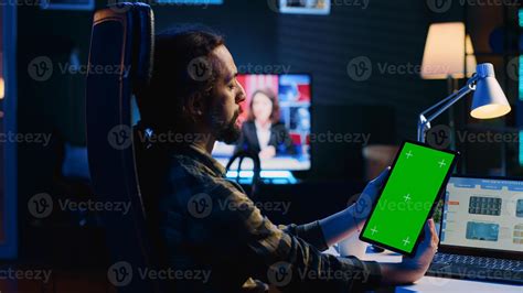 Remotely Working Man In Home Office Checks Statistical Financial Graphs