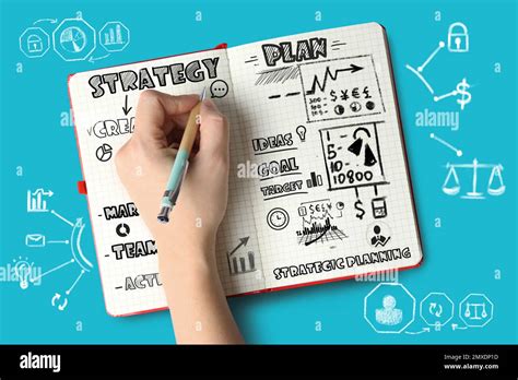 Strategic Planning Concept Woman Drawing Scheme In Notebook On Blue Background Top View Stock