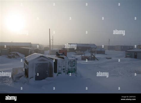 Arctic Community Covered In Snow Following A Blizzard Located In