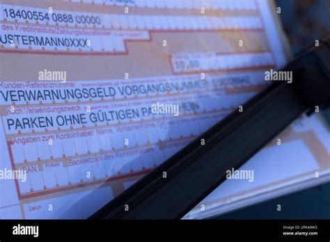 Demand For Payment On The Windshield Of A Car Parking Ticket For