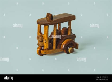 The Car Has Three Round Wheels And A Smooth Rectangular Body This Image Could Be Used To