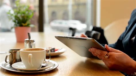Man Reading News With Digital Tablet And Drink Coffee Shot On RED Digital Cinema Camera In 4K
