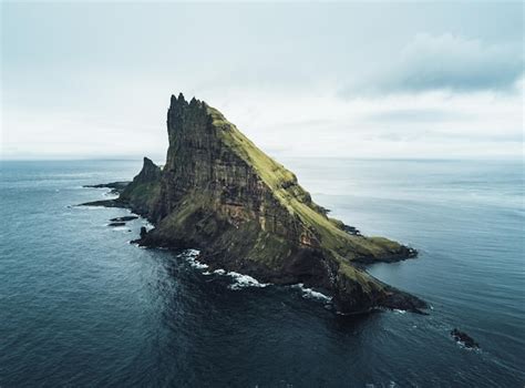 Premium Photo Aerial View Of The Rugged Tindholmur Island On The