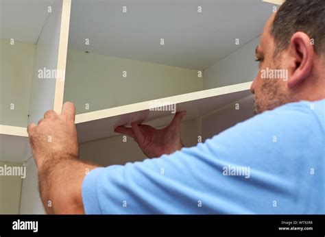 Installing Shelves Hi Res Stock Photography And Images Alamy