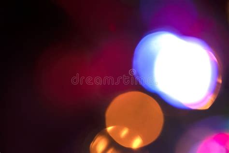 Blur And Defocus With Low Opacity Light Bulb Multi Colors Dark Bokeh Background Stock Image
