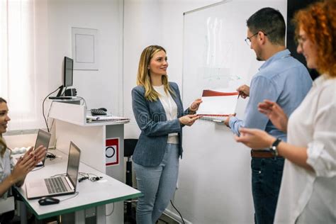 Teachers Teaching Young Students A Programming Class In The Classroom