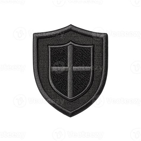A Black Embroidered Shield Patch With Cross Design Symbolizes