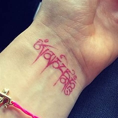 Ellie Gouldings Tibetan Jewel In The Lotus Tattoo Steal Her Style