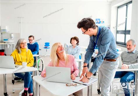 Group Of Cheerful Senior People Attending Computer And Technology