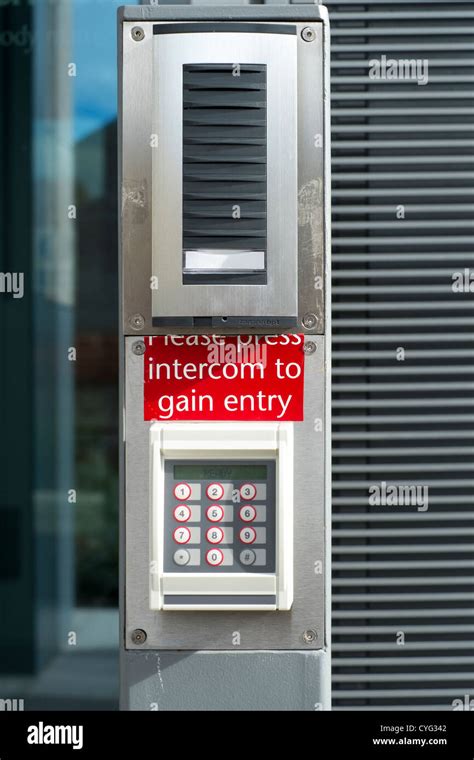 Electronic Keypad Door Lock With Intercom At Entrance To Office Stock