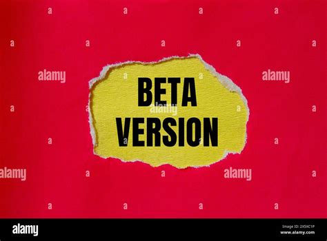Beta Version Words Written On Ripped Red Paper With Yellow Background