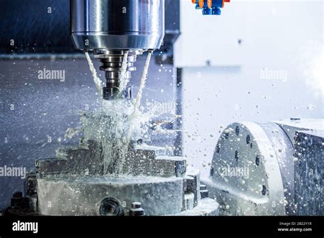 A Process Of Industrial Wet Milling In 5 Axis Cnc Machine With Coolant Flow Under Pressure And