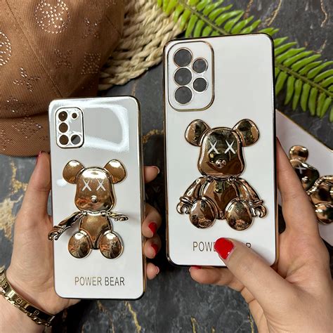 قاب گوشی سامسونگ ژله ای My Case مای کیس مدل خرس تدی طلایی برجسته محافظ لنز دار پاپ سوکت دار سفید